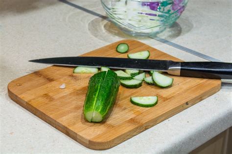 Cucumber Slices With Knife On Cutting Board Stock Image Image Of