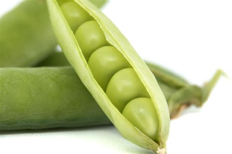 Premium Photo Fresh Green Peas In A Pod On A White Background