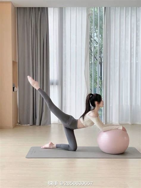 A Woman Is Doing Yoga On An Exercise Ball