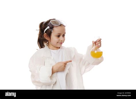 Smart Pupil Points At A Flask With Yellow Chemical Liquid In Practical Classes In Chemistry