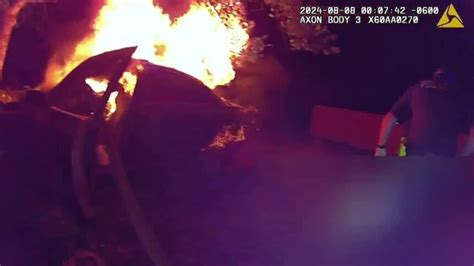 Body Cam Video Shows Heroic Officers Witness Rescuing Driver After