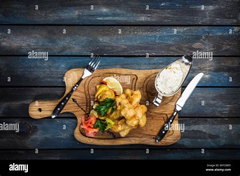 Fish And Chips With Sauce Tartar Served With Cutlery Stock Photo Alamy