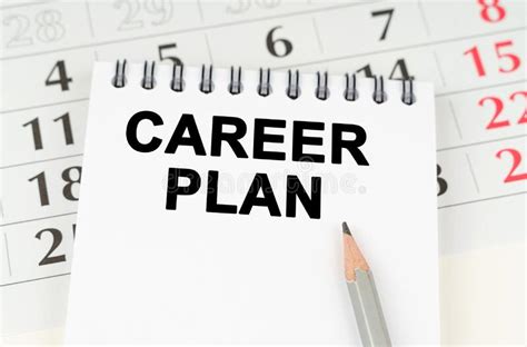 On The Calendar Is A Notebook With The Inscription Career Plan Stock