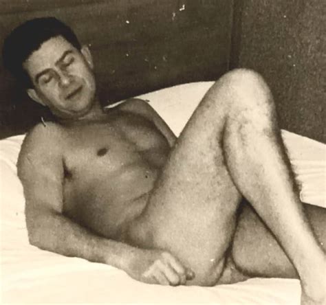 Male Nude Handsome Naked Man Lying On A Bed With His Eyes Closed