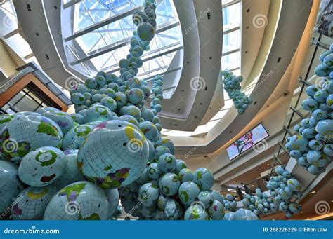 A Group Of Planet Earth Globe Balloons Was Installed In The Atrium Of