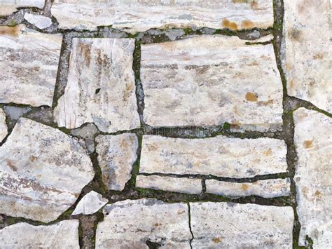 The Surface Features Irregularly Shaped Stones With Visible Cracks And