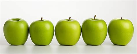 Premium Ai Image A Row Of Green Apples