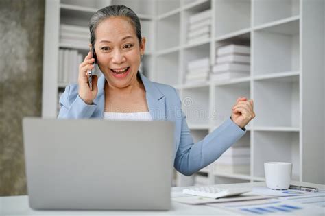 Happy Senior Businesswoman Feeling Exited After Hearing A Good News