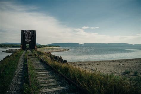 The Atlantic Ocean And The Rail Track Bridge In Barachois Near Perce