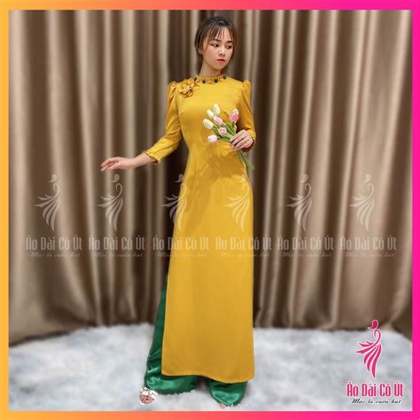 Áo dài lụa tây thi tay bồng cánh dài cổ xếp ly đính cúc đính hoa đẹp dùng