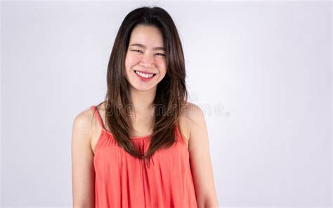 Asian Woman Smiling And Wearing Pink Shirt For Summer Vacation Stock
