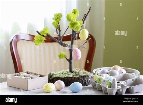 Florist At Work Woman Shows How To Make Easter Decoration In Tree