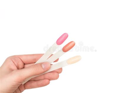 Female Hand Holds Tips With Nail Polish Color Shades Samples Manicure