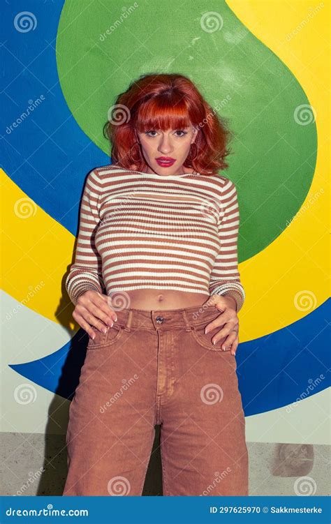 Young Stylish Redhead Caucasian Woman In Retro Style Of 70s Posing At