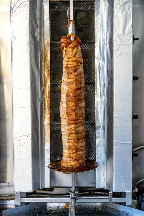 Vertical Meat Skewer Rotating In Doener Grill With Heating Module Stock