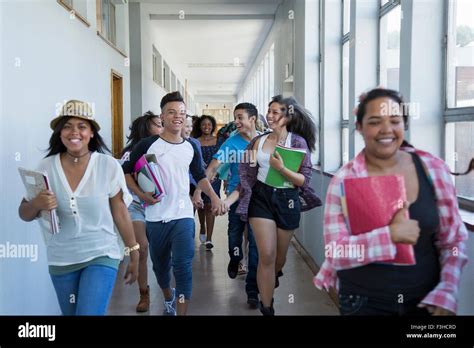 Babes Running Down Hallway Laughing Stock Photo Alamy