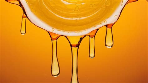 Premium Photo Bright Dripping Oil Close Up As Background