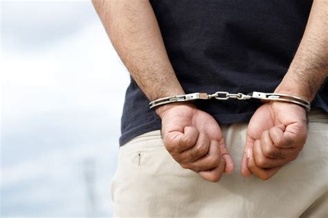 Premium Photo The Thief Was Arrested By The Police For Stealing Gold