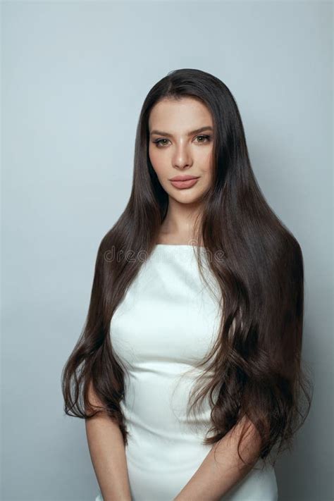 Attractive Lady In White Silky Dress Posing Elegant Fashion Model With