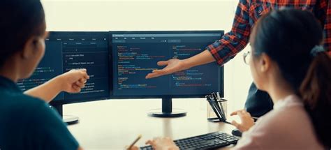 Premium Photo Young Professional Website Developer And Cooperative Computer Engineer Team