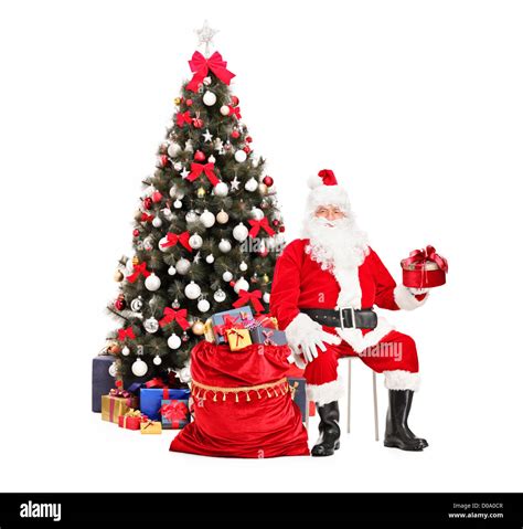 Avec Un Cadeau Du Père Noël Assis à Côté Dun Sac Plein De Cadeaux