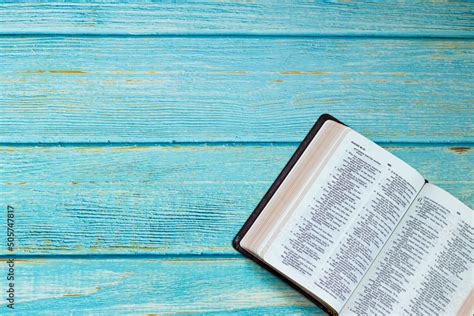 Open Holy Bible Book On A Blue Wooden Table Background With Copy Space Top View Flat Lay