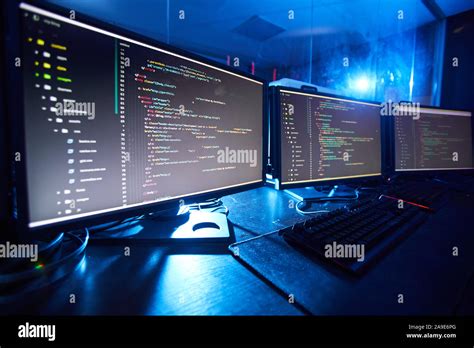 Image Of Computer Monitors Updating The Software They Standing On The Table In Dark Room Stock