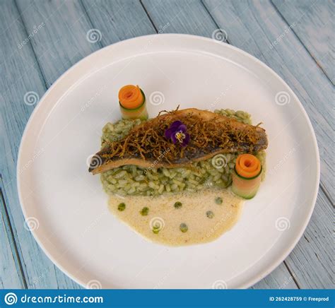Recipe For Fried Fillet Of Sea Bass With Herb Risotto White Wine Sauce