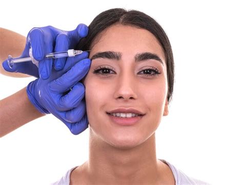 Premium Photo Young Woman Gets Injection Of Botox In Her Lips Woman