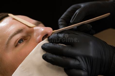 Hair Removal Procedure In A Barbershop Nose Hair Wax Removal Stock