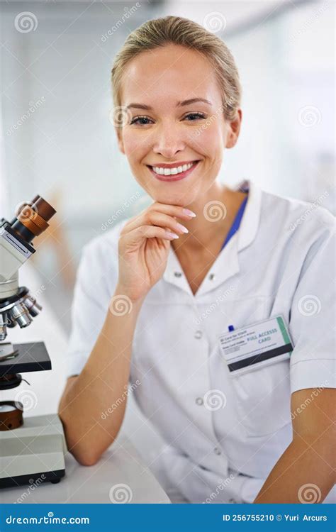Science Just Got Sexy Portrait Of A Smiling Female Researcher Sitting