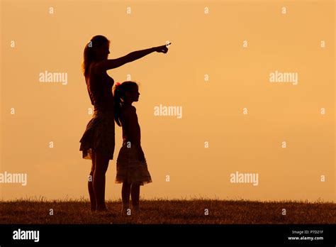 Mother And Daughter Enjoy Spending Time Together In Nature Stock Photo Alamy