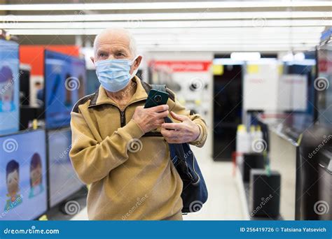 Senor Man Pensioner In Antiviral Mask Select Modern Digital Televisor