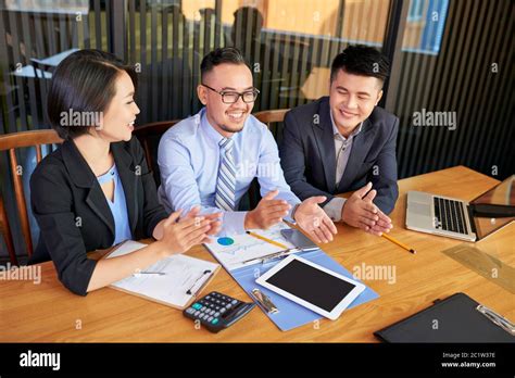 Group Of Three Business People Clapping Their Hands After Listening To