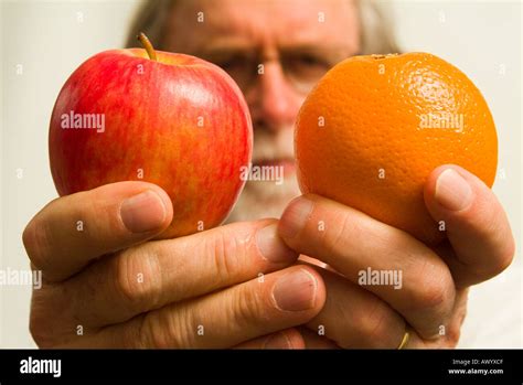 Comparing Apples With Oranges Stock Photo Alamy