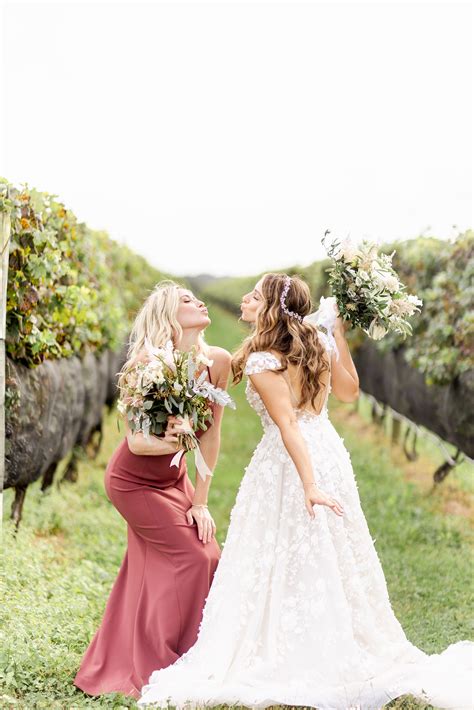 Bride And Bridesmaid Pose Raphael Winery Peconic Ny Wedding Deanna And Nick Bridesmaid