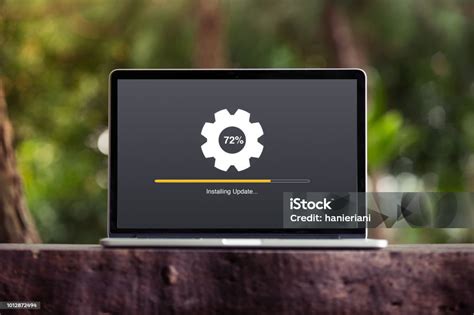 Installing Update Process With Gearbox Percentage Progress And Loading Bar On Laptop Computer