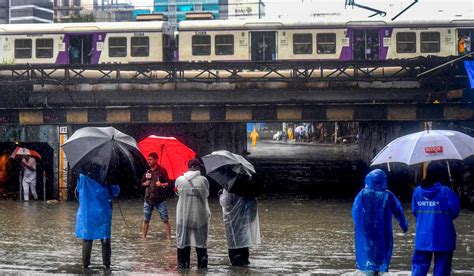 Heavy Rain Imd Red Alert For Mumbai Waterlogging In Delhi 10