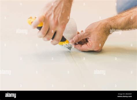 European Man Working At Home Laying Polystyrene Substrate For Laying