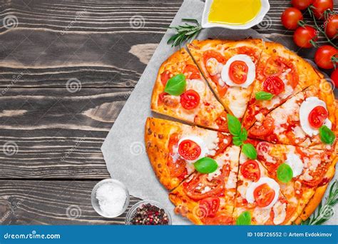 Sliced Margherita Italian Pizza With Melted Mozzarella Cheese Tomato