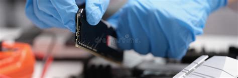 technician connects cpu microprocessor to motherboard socket stock