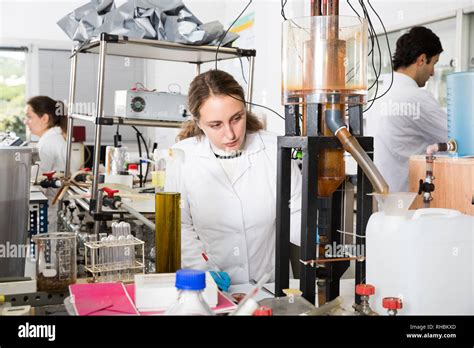 Female Babe Of Faculty Of Chemistry Working In Research Laboratory Performing Experiments On