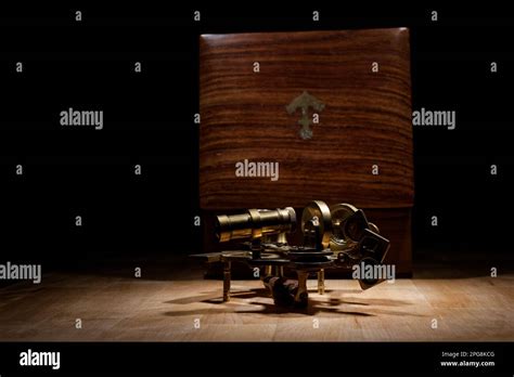 Old Sextant Spyglass Circle And Compass Lying On Wooden Table Stock