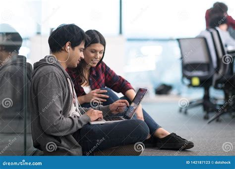 Software Developers Couple Working On The Floor Stock Image Image Of