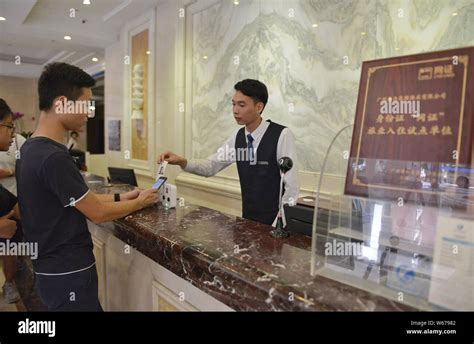 a chinese mobile phone user uses his electronic identification card in