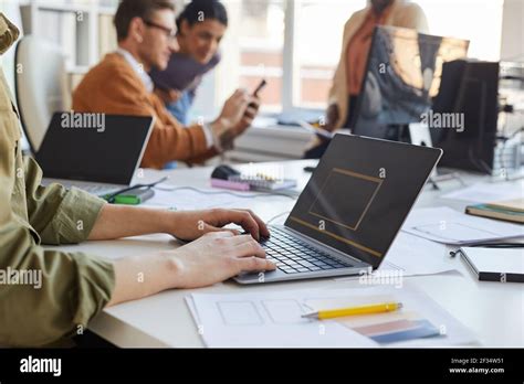 Side View Closeup Of It Programmer Writing Code On Laptop Screen While