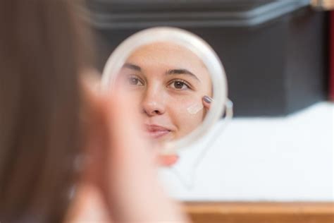 Premium Photo Reflection Of Smiling Young Woman In Mirror