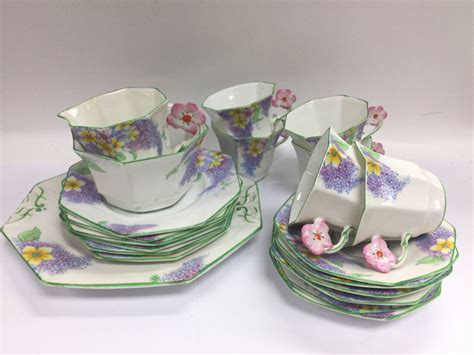 An Aynsley Tea Set In Lilac Time Pattern Shipping Category D