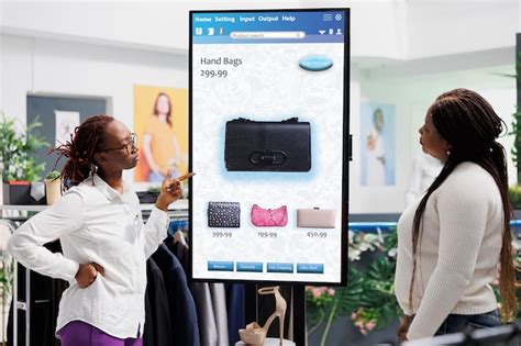 Premium Photo Store Assistant Showing Items To Woman