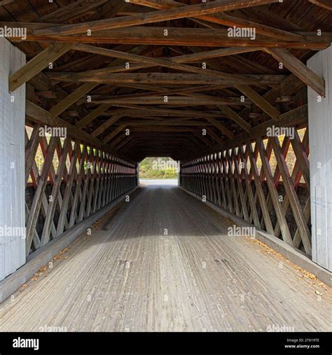 town lattice truss structure of 1840 wooden henry covered bridge over